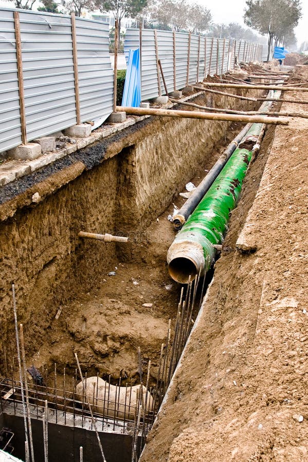Pipes with Heat Isolation Lieing in the Trench. Stock Photo - Image of ...
