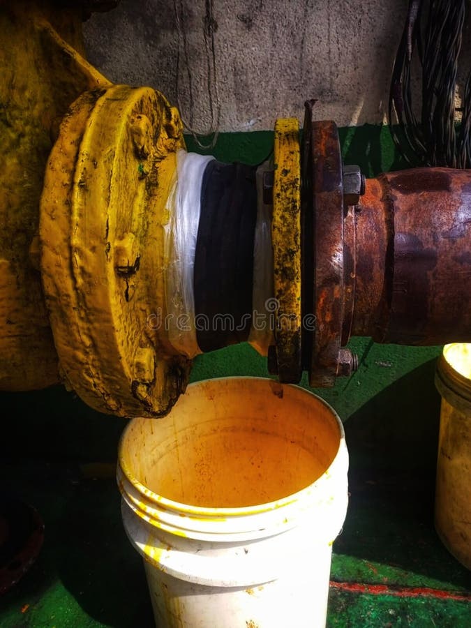 Pipes for Loading and Unloading Dripping Crude Palm Oil Covered in ...