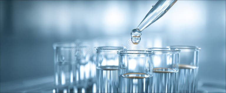 The Pipette Dispensing a Drop into a Test Tube in a Laboratory Setting ...