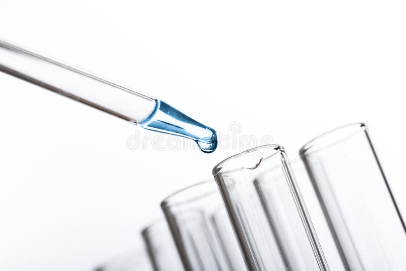 Pipette with a Drop and Scientific Laboratory Test Tubes in a Research ...