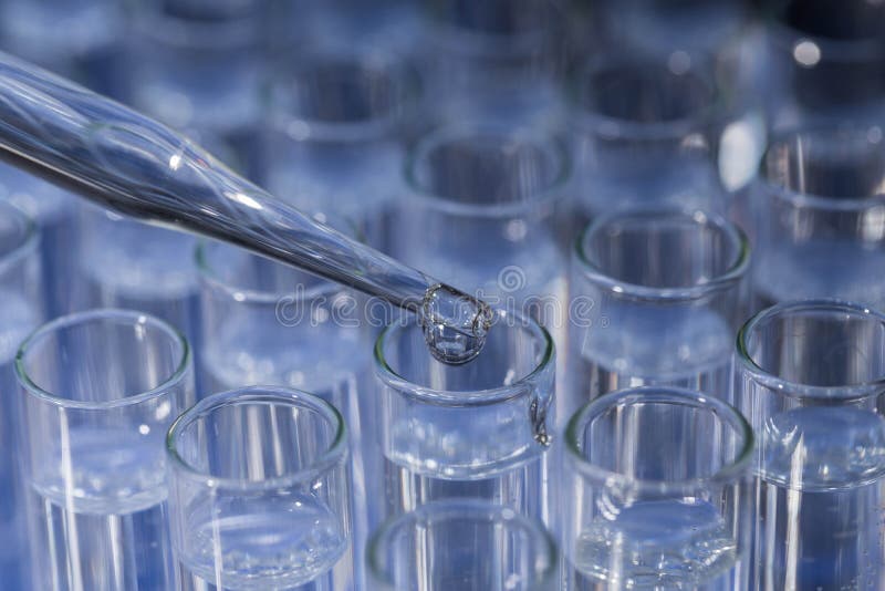 Pipette Dropping Fluid into Test Tube Stock Photo - Image of glass ...
