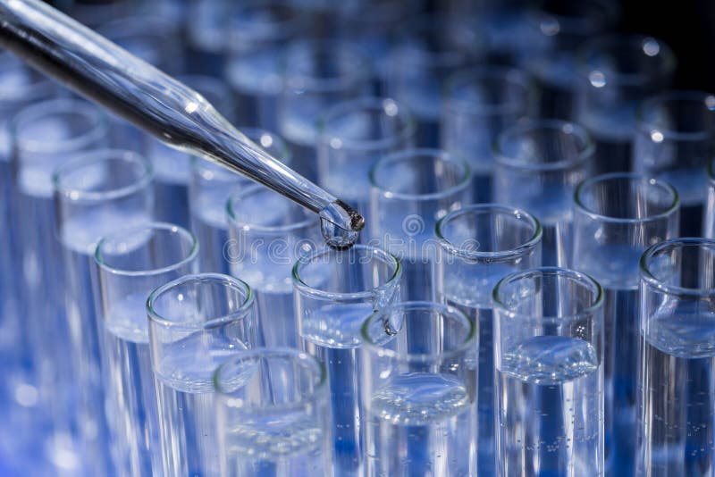 Pipette Dropping Fluid into Test Tube Stock Photo - Image of glassware ...