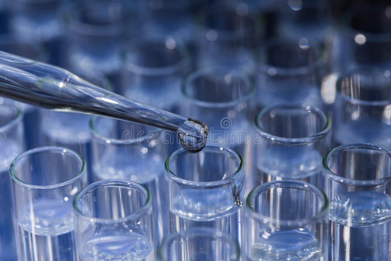 Pipette Dropping Fluid into Test Tube Stock Photo - Image of laboratory ...