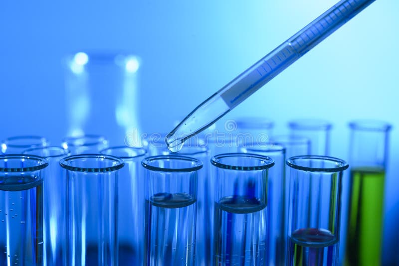 Pipette Dropping Sample into Test Tube Blue Light Stock Image - Image ...