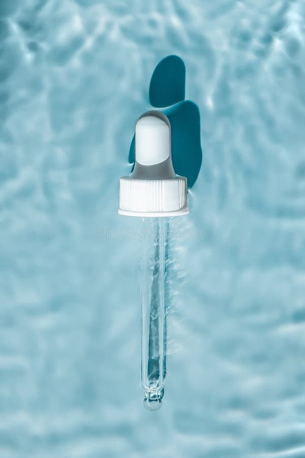 The Pipette is in the Water . Stock Photo - Image of bottle, beauty ...