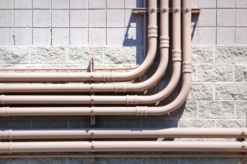 Metal Pipes Mounted On A Wall Stock Photo - Image of hard, steel: 59722028