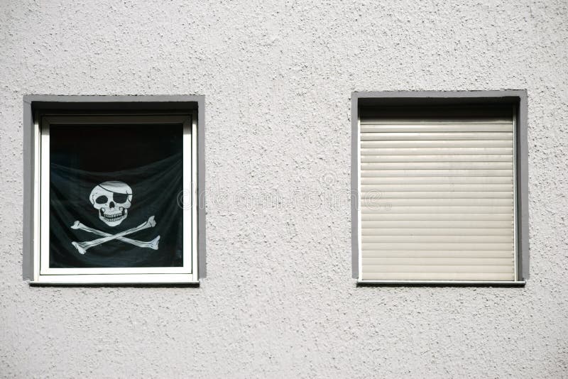 Pirate flag in the window stock image. Image of detail - 143856425