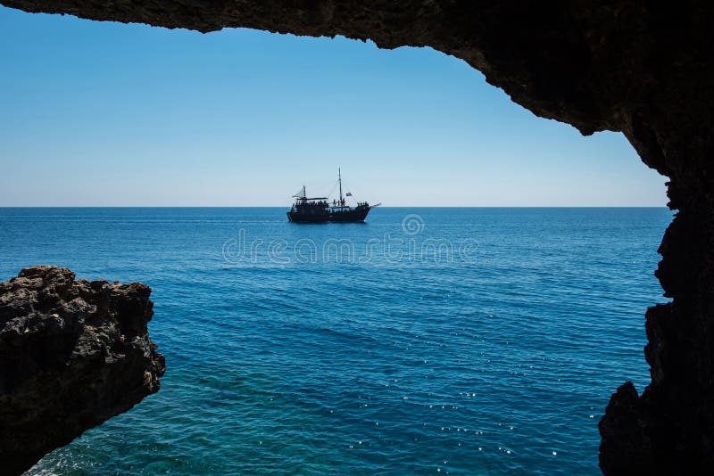 Pirate Ship Sailing in the Sea. View from a Cave Stock Photo - Image of ...