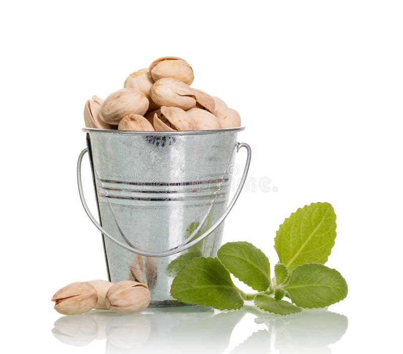Pistachio nuts in a bucket stock photo. Image of isolated - 54864260