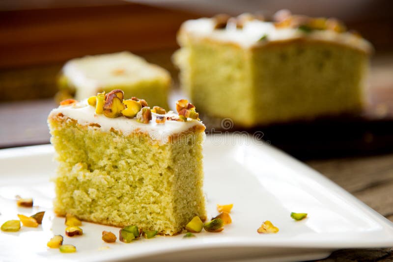 Pistachio Sponge Cake Covered in Icing Sugar. Stock Image - Image of ...