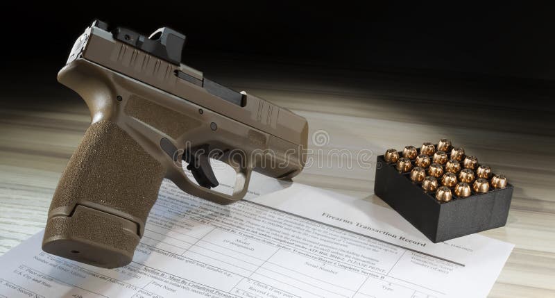Pistol with Ammo and Public Domain Background Check Form Stock Image ...