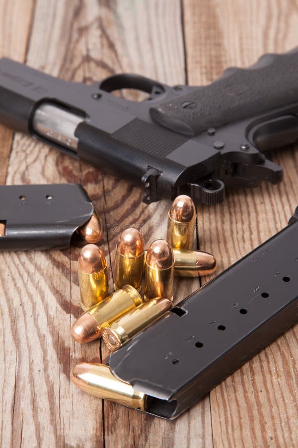 Pistol with Bullets stock image. Image of bullet, pistol - 47631069