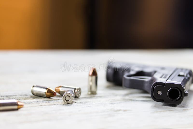 Pistol Handgun and Bullets stock image. Image of shooting - 107118315
