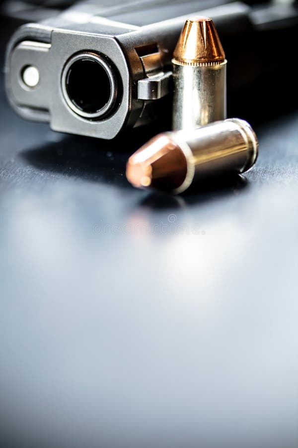 Pistol Handgun and Bullets stock image. Image of space - 107121593
