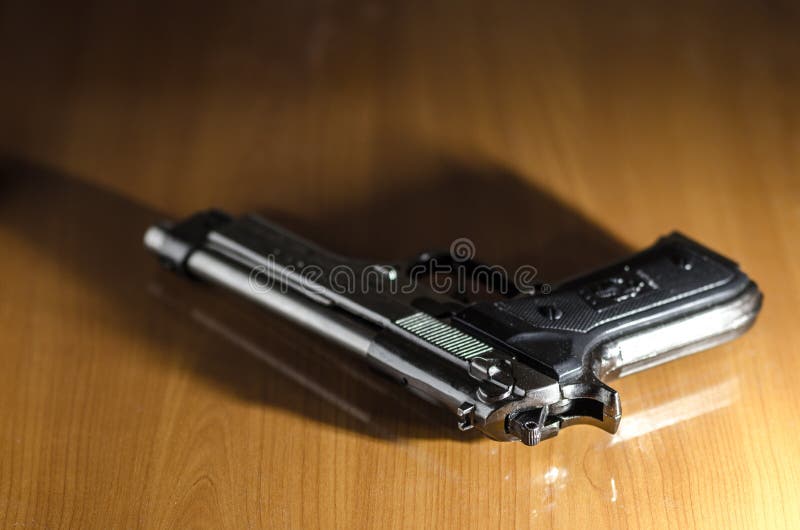 Pistol on the table stock image. Image of defense, military - 60424435