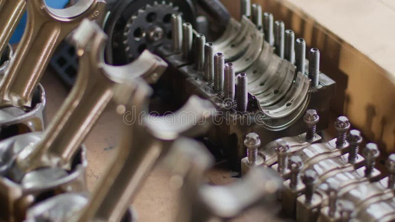 The Pistons and Connecting Rods Lie Disassembled on the Surface of the ...