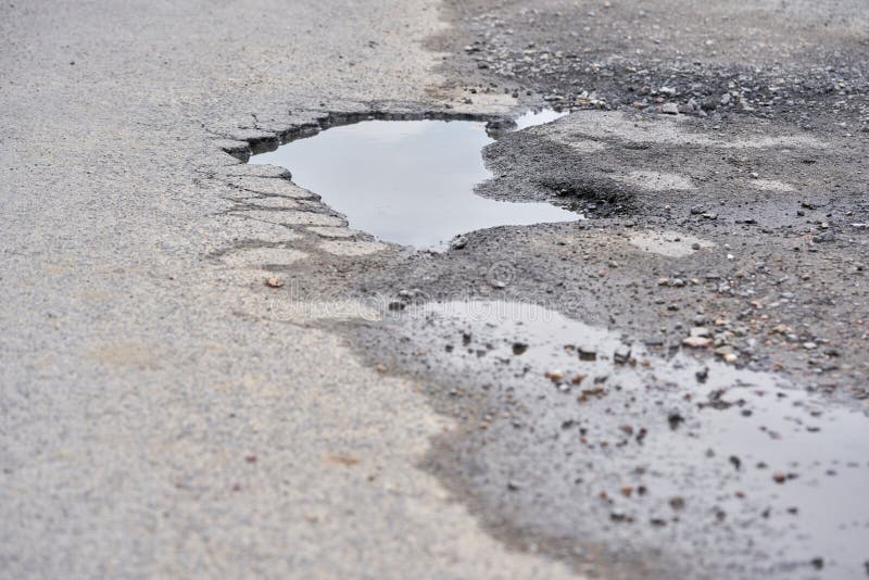 Pit on Asphalt Road Filled with Water Stock Photo - Image of rock, road ...