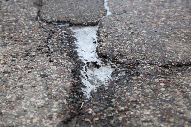 The Pit on the Asphalt Road with Puddle Stock Image - Image of asphalt ...