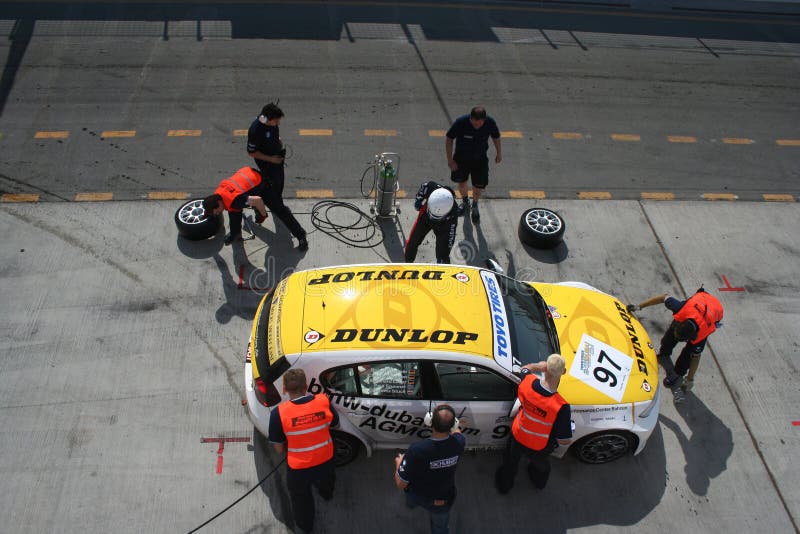 Pit Crew in Action editorial stock photo. Image of traction - 20124213