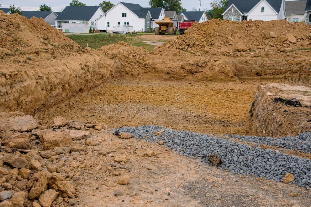A Pit Dug for the Foundation of a New House Stock Image - Image of ...