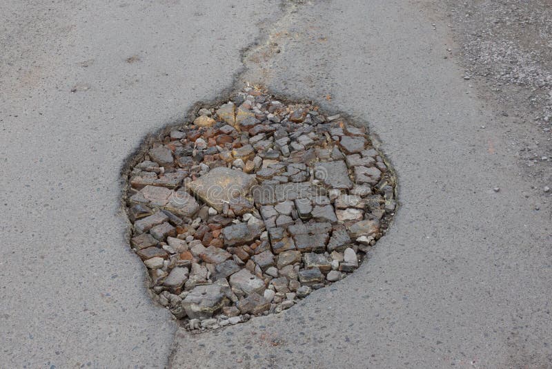 Pit on the Road Repaired with Bricks Stock Image - Image of pavement ...