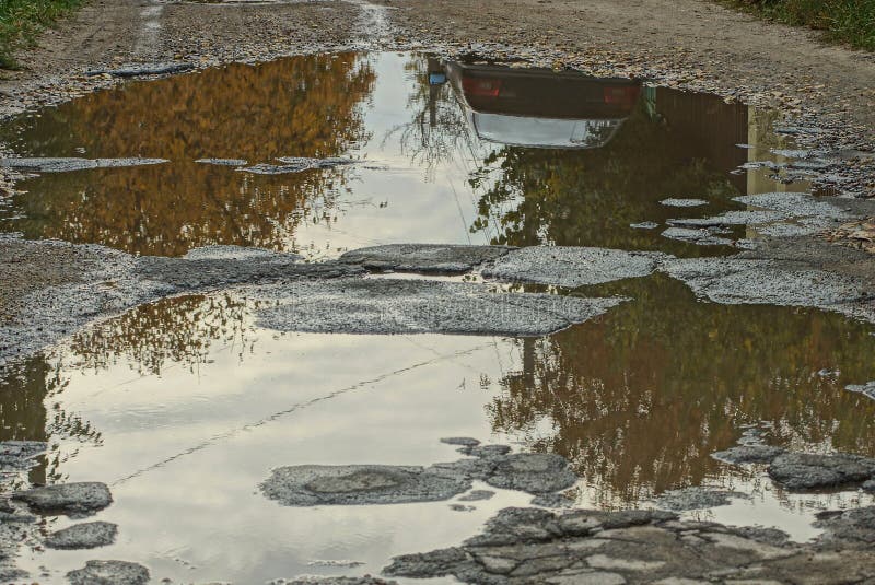 Pit with Water on an Old Broken Asphalt Road Stock Image - Image of ...
