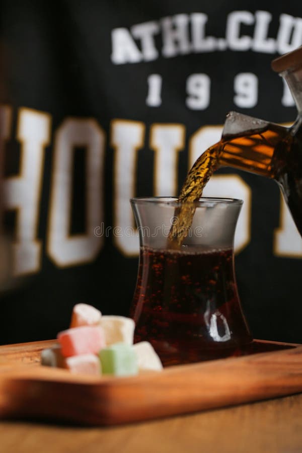 Pitcher Pouring Tea into Glass with Marshmallows Stock Image - Image of ...