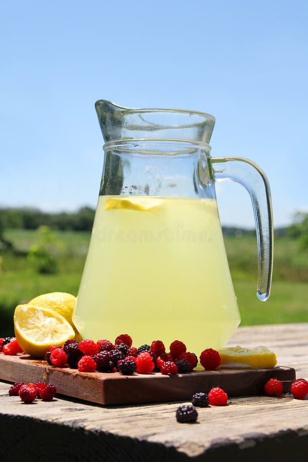 Cold Lemonade on Green Grass in Summer Stock Photo - Image of berry ...