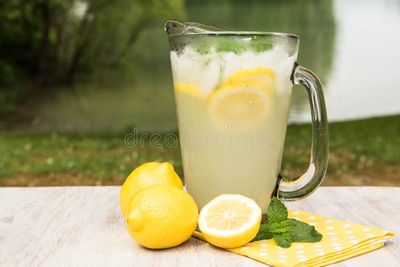Pitcher of Lemonade Next To Lake Stock Image - Image of relax, sliced ...