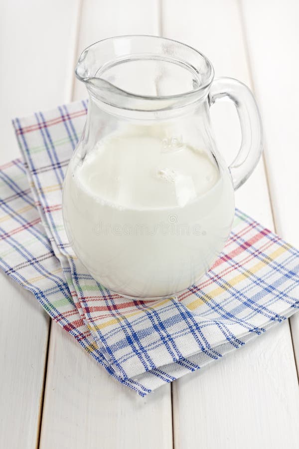 Pitcher with Milk, Egg, Cottage Cheese, Butter and Yogurt on Kitchen ...