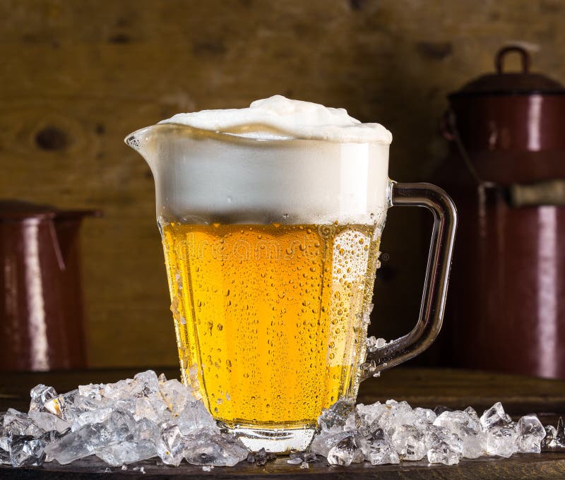 Pitcher stock photo. Image of beverage, glass, gold, drops - 73412026