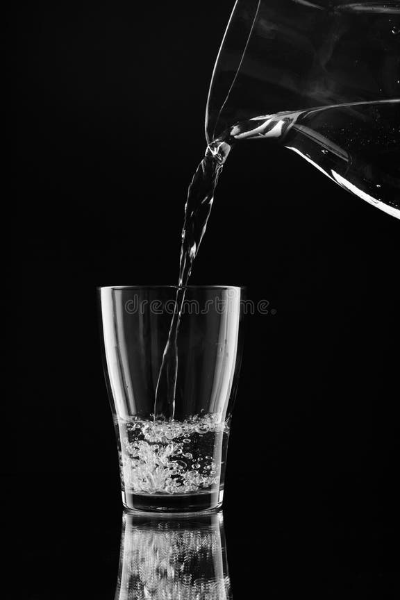 Pitcher pouring a glass stock image. Image of stream - 20797605