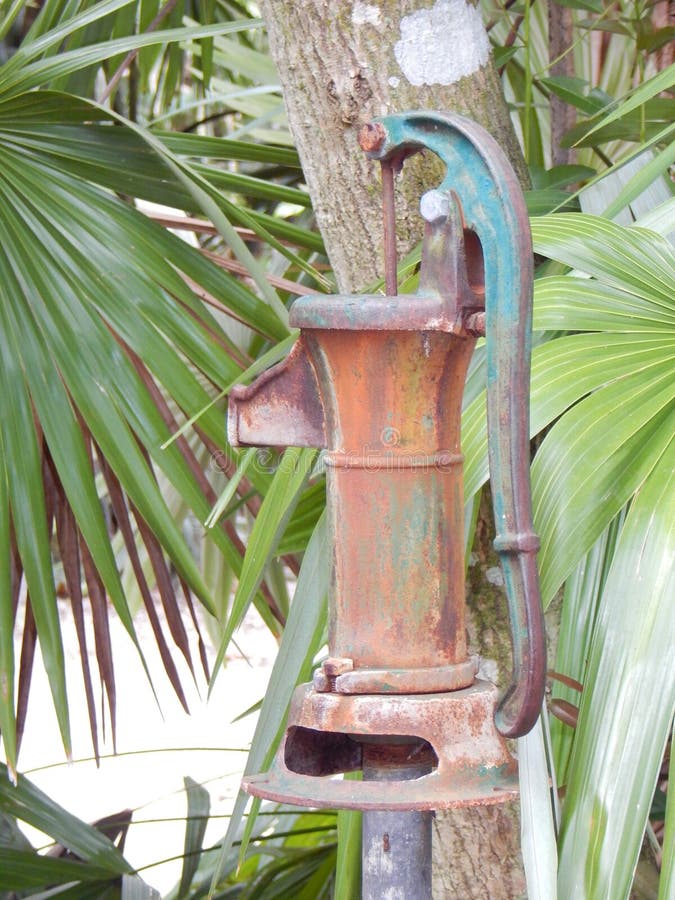 Red Pitcher Pump with Child Hand Stock Photo - Image of culture, retro ...