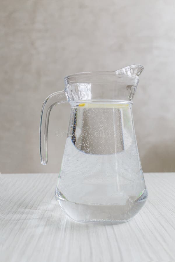 Pitcher of Water on Grained Wood Natural Background Stock Photo - Image ...