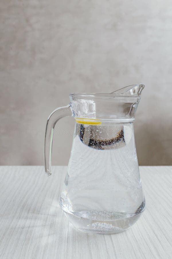 Pitcher of Water on Grained Wood Natural Background Stock Image - Image ...