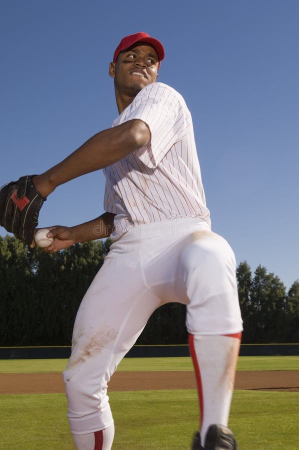 Pitcher Winding Up To Throw the Baseball Stock Image - Image of ...
