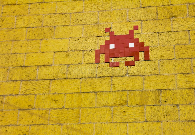Pixel Art of an Alien on a Yellow Brick Wall Stock Photo - Image of ...