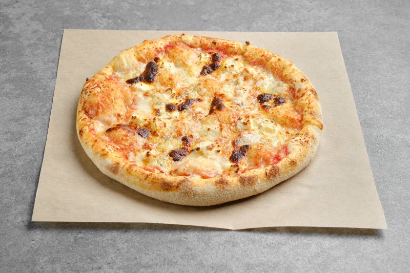 Pizza with Assortment of Cheese on Parchment Paper Stock Photo - Image ...