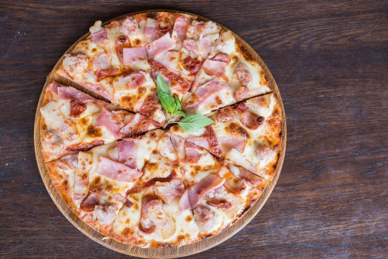 Homemade Pizza Hawaii with Pineapple and Ham on Dark Stone Background ...