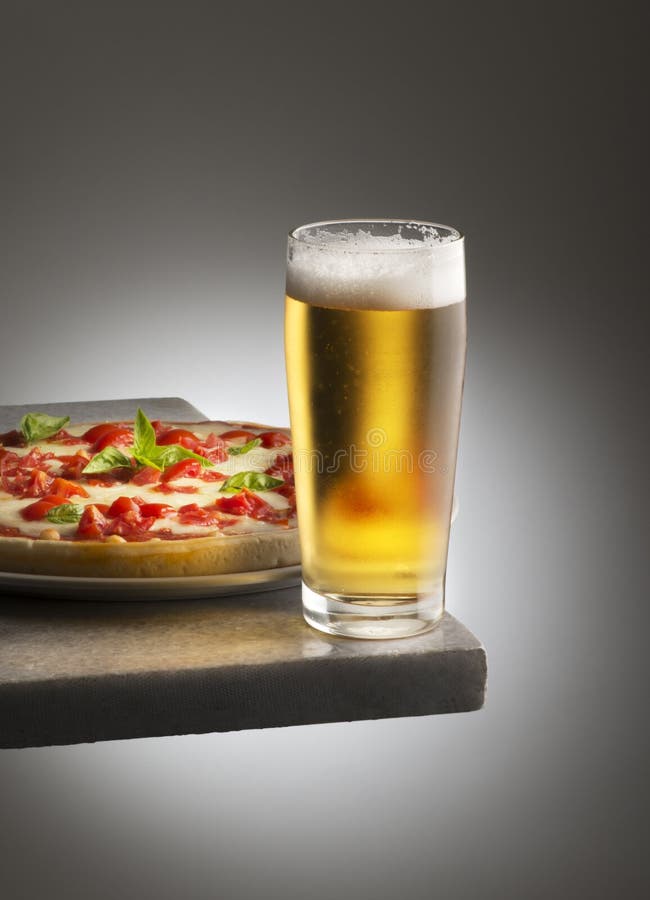 Pizza and beer stock image. Image of tomatoes, pizza - 35268763