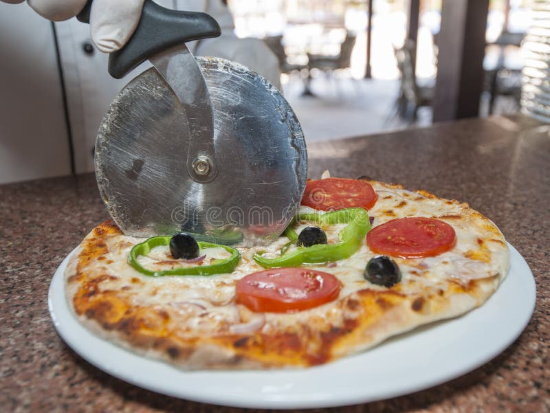 Pizza Being Cut into Slices Stock Image - Image of cutter, cheese: 46022391
