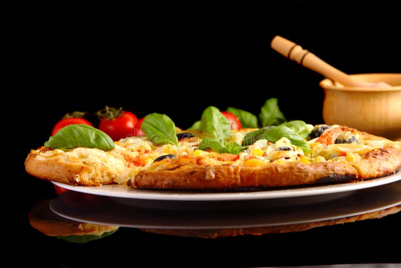 Pizza in black stock image. Image of basil, rustic, colorful - 28266863