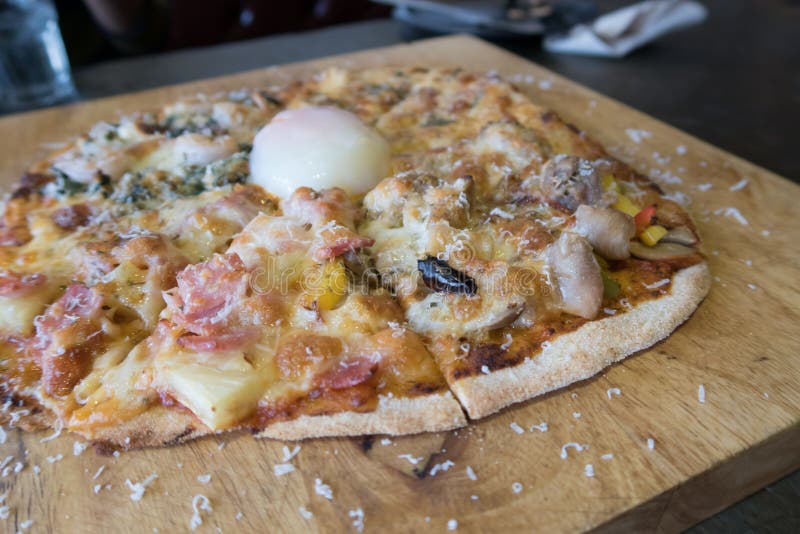 Pizza with boil egg stock image. Image of culture, indoors - 70064859