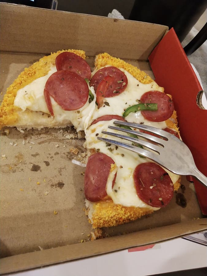 Pizza in a box with a fork stock photo. Image of meal - 338310516