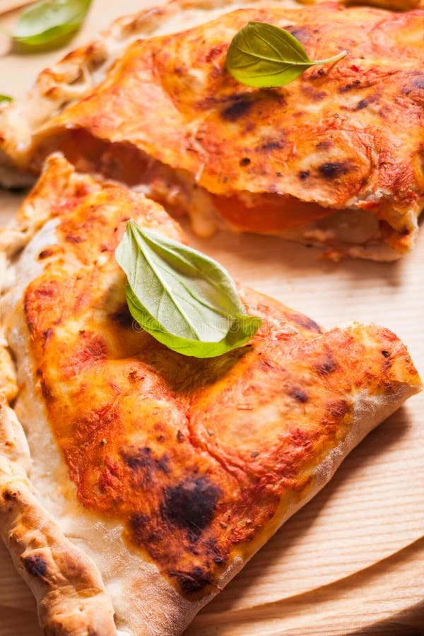 The Pizza calzone stock photo. Image of golden, tasty - 62820052