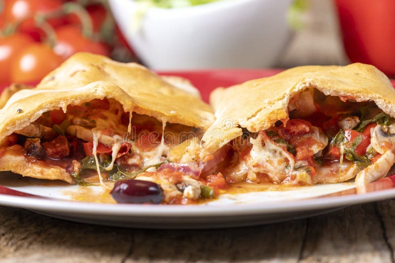 Pizza calzone stock image. Image of fresh, mushrooms - 205992885