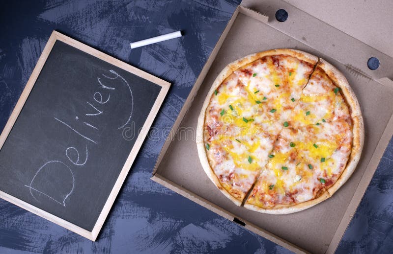 Pizza with Cheese in a Cardboard Box and the Chalkboard with the Word ...