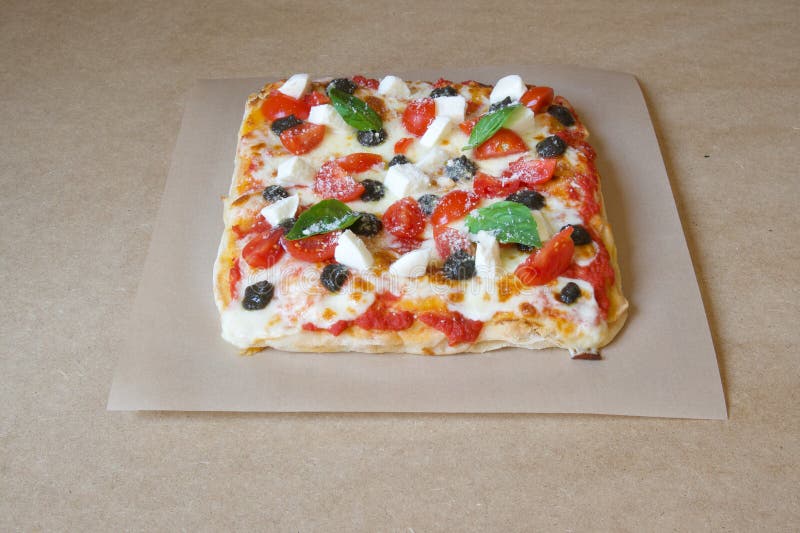 A Pizza with Cheese, Tomatoes, and Basil on Top Stock Photo - Image of ...