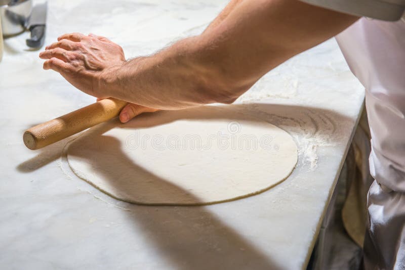 Pizza chef at work stock photo. Image of finger, cheese - 39475874