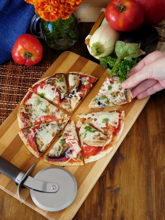 Pizza cut into portions stock photo. Image of calorie - 97874954